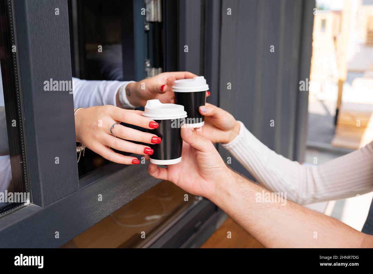 Couple takes takeaway coffee. Break and go outside. Outdoor date Stock ...