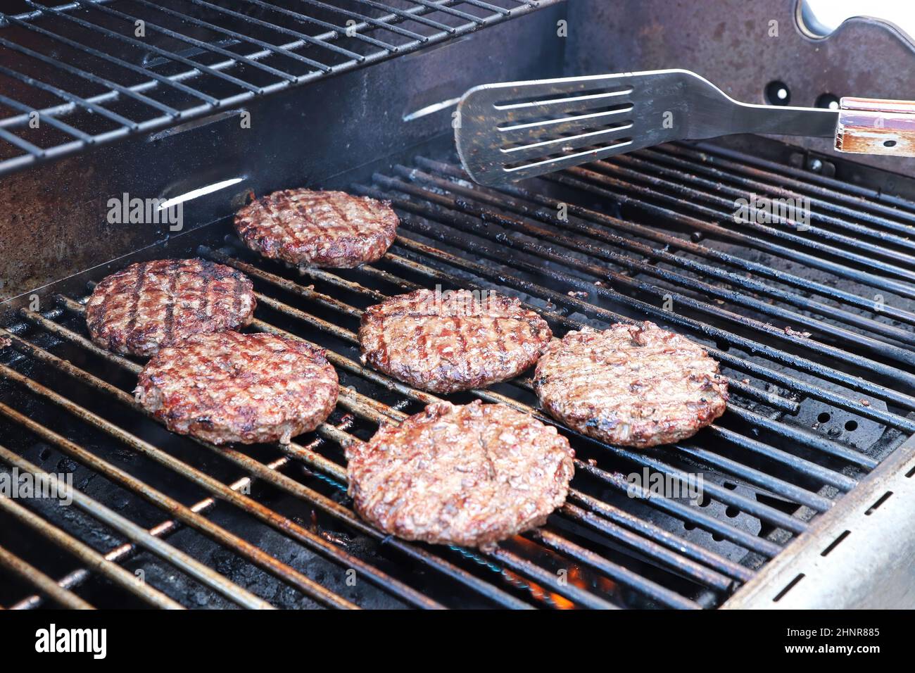 Flipping burger on a grill hi-res stock photography and images - Alamy