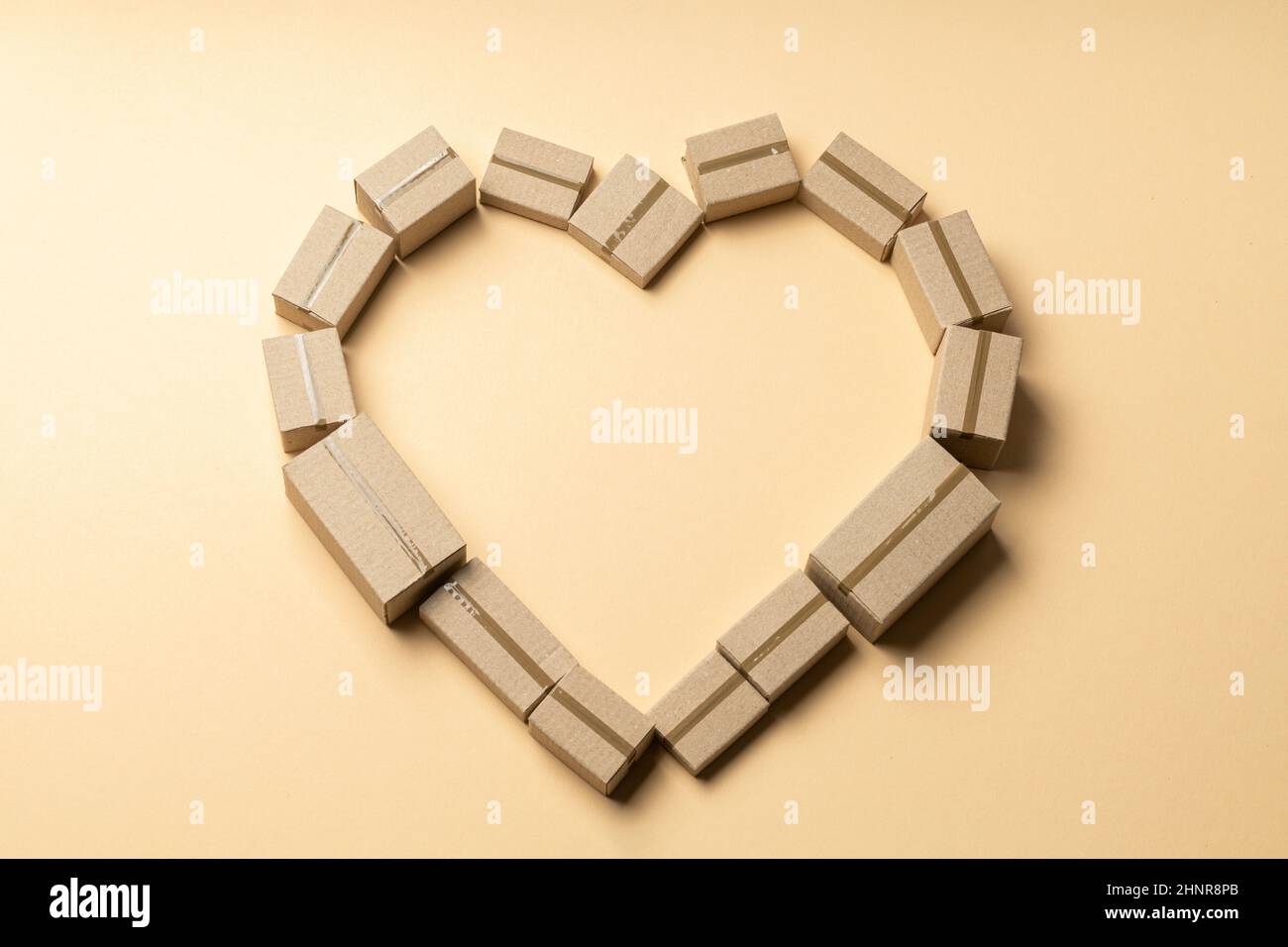 Heart symbol made from cardboard boxes on a brown background. Favorite ...