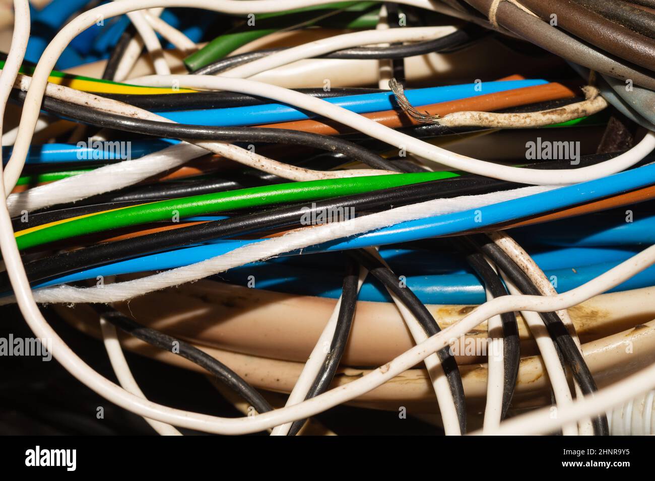 Used electric colorful wires. hank of different old cables close up ...