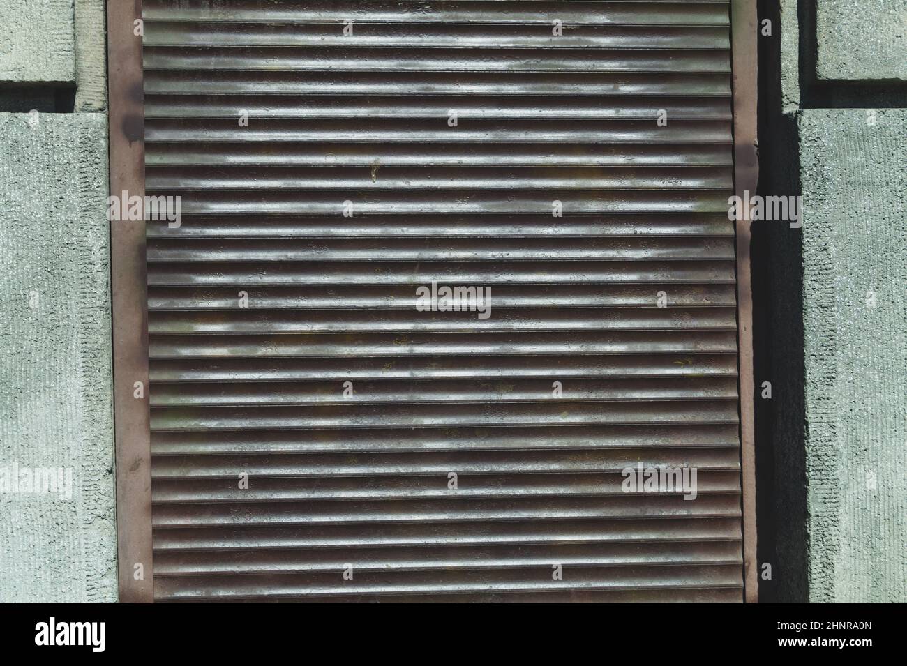 Iron window blind. rusty metal roller shutter. metal curtain close up ...