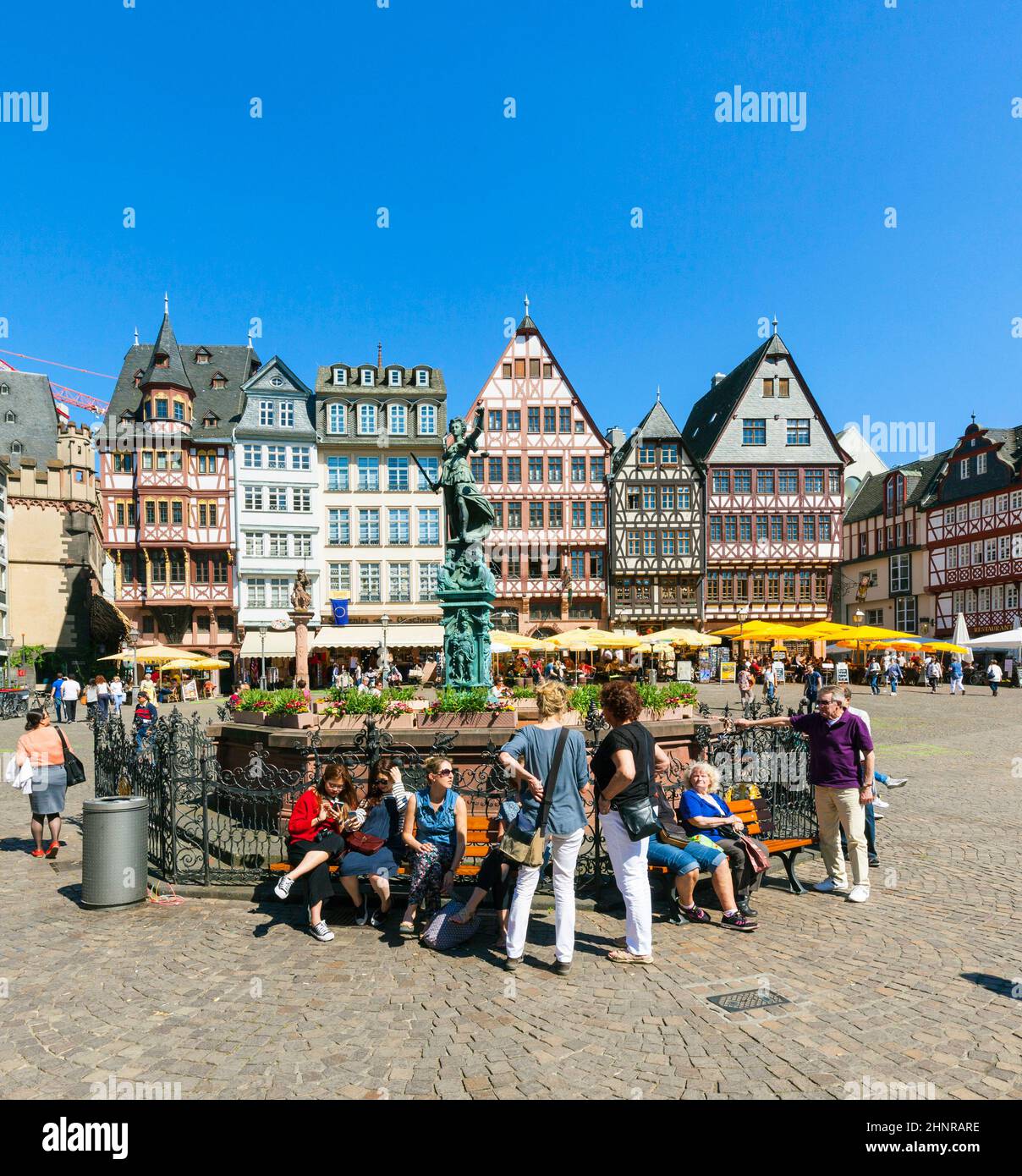 people visit Romerberg (Romerplatz) with old buildings in Frankfurt ...