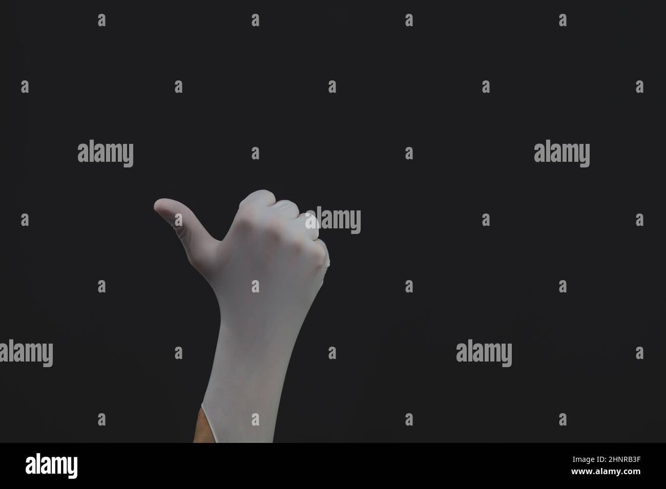 Hand in white medical glove shows thumbs up on a black background Stock ...