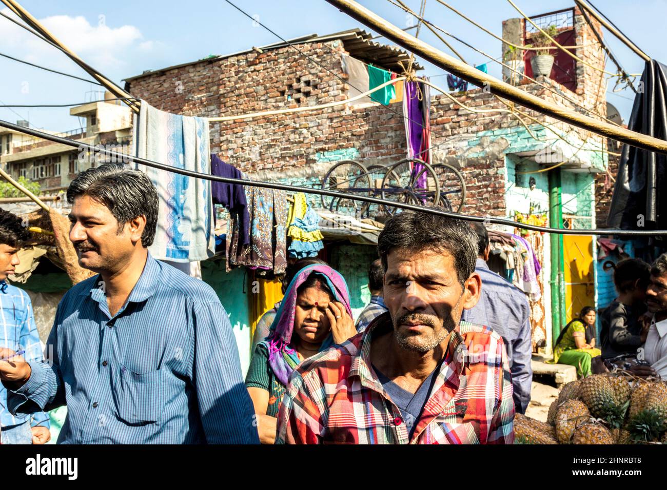 street scene with people in the poor area of New Delhi Stock Photo - Alamy