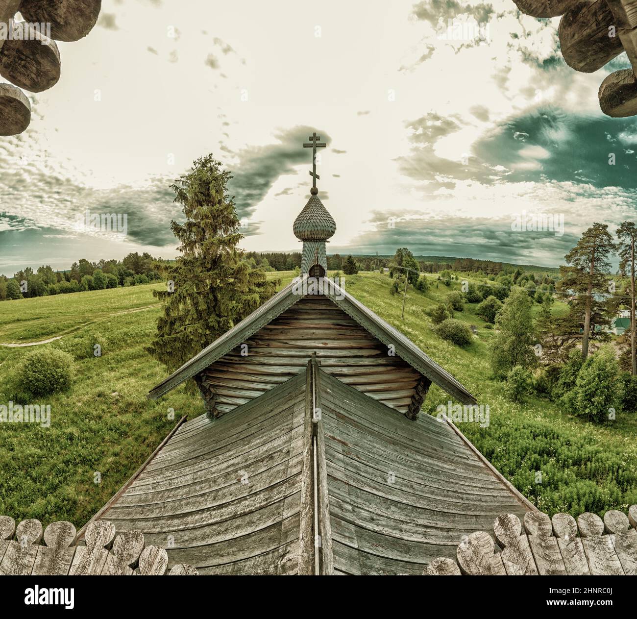 Old wooden church on the pasture field. rural panoramic landscape. roof ...