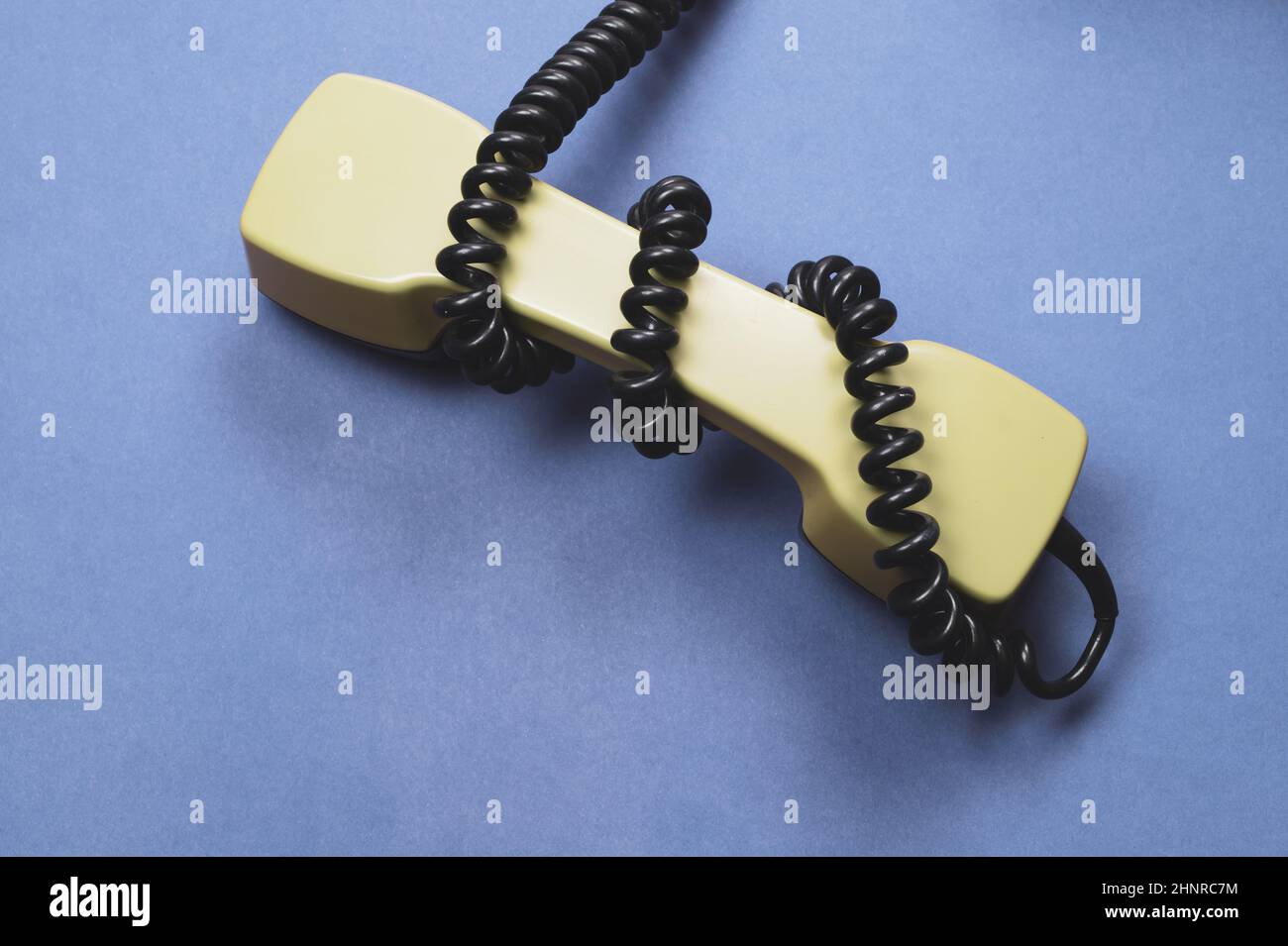 Vintage green telephone handset. phone receiver isolated on blue ...