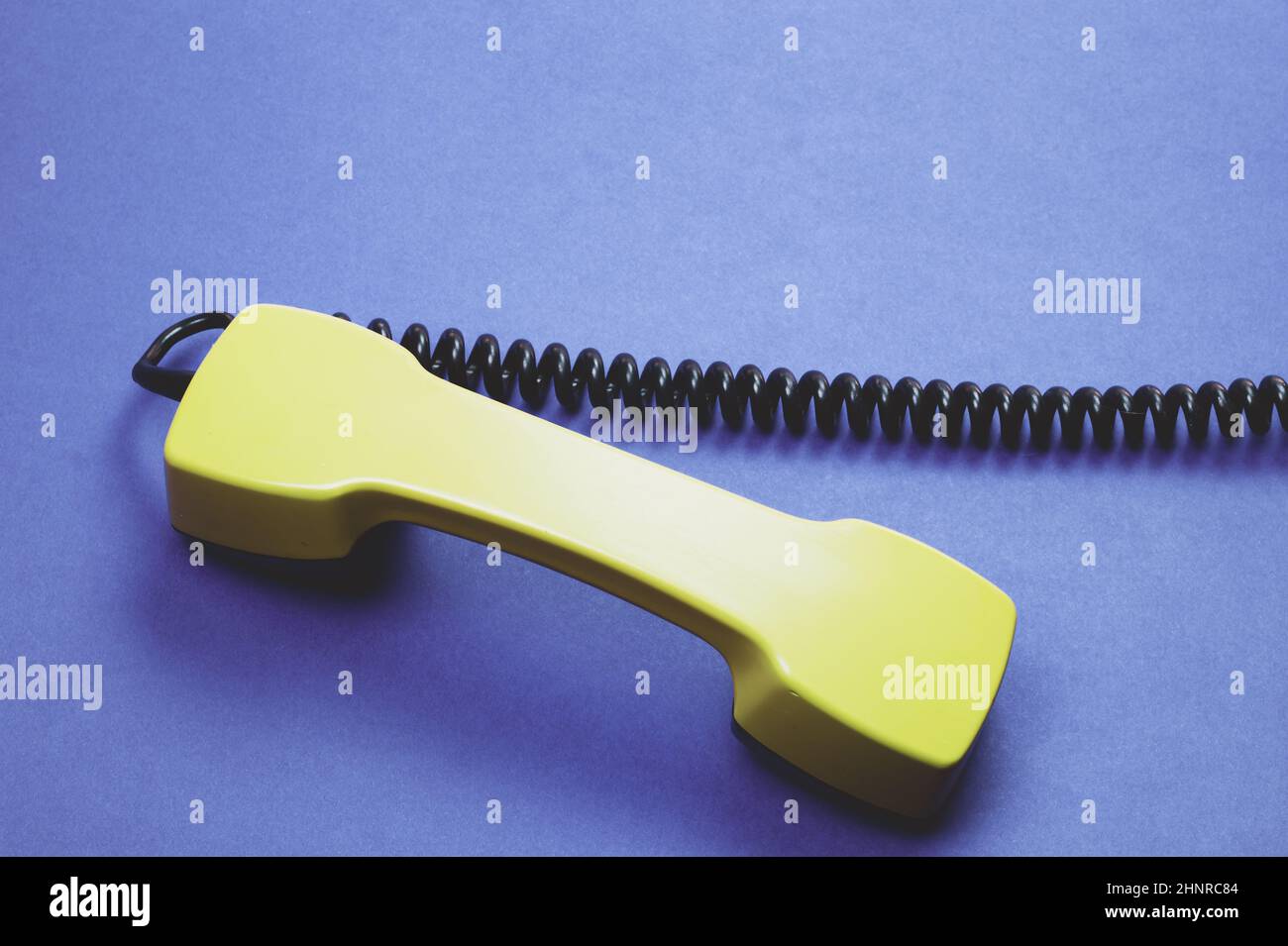 Retro telephone handset. phone receiver on blue background. old ...
