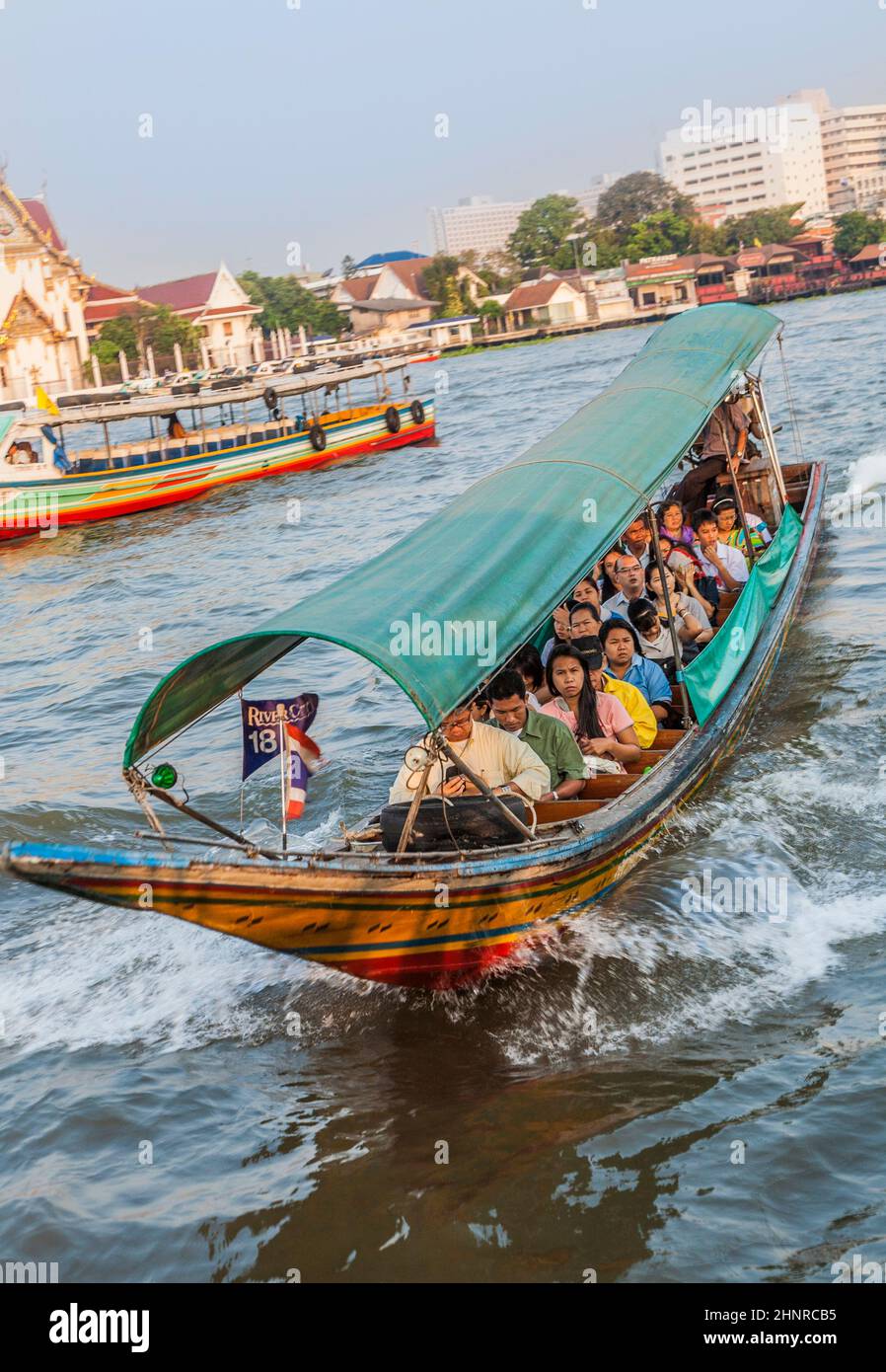 people travel in the morning with longboats at the river Chao Phraya ...