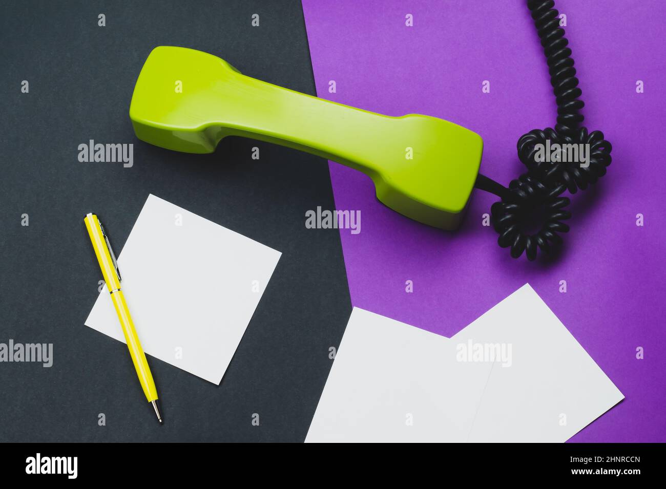 Vintage telephone handset. pen and a note. office background. phone ...