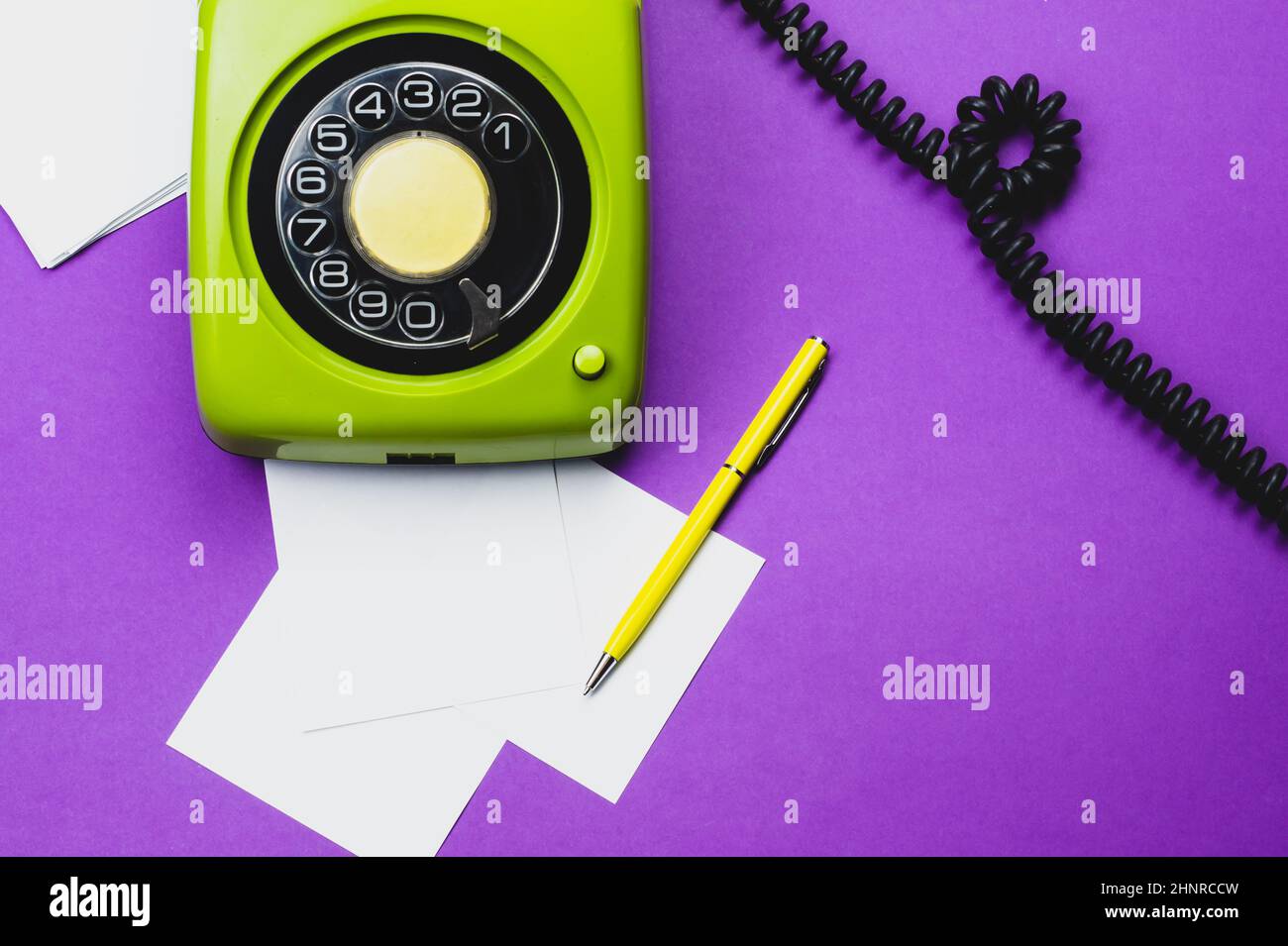 Classic phone with handset. pen with a note. office background. vintage ...