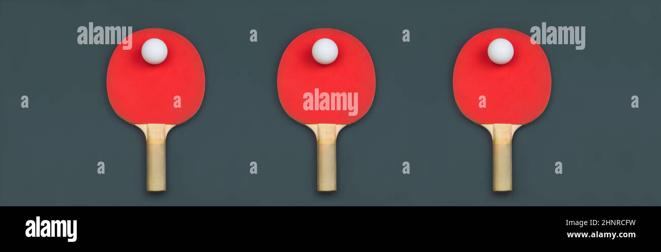 Red table tennis rackets with balls on a colored background. sport ...