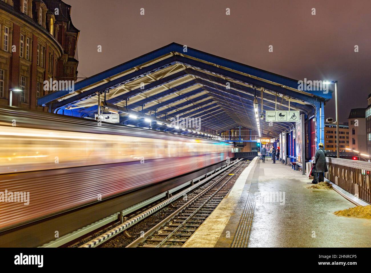 people waiting for train in direction Barmbek Stock Photo - Alamy