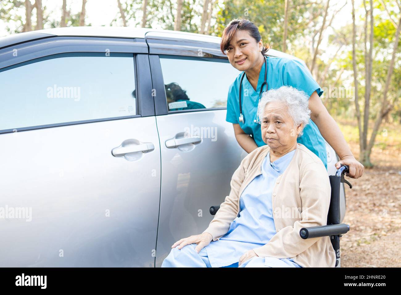 Doctor help and care Asian senior or elderly old lady woman patient sitting on wheelchair at ...