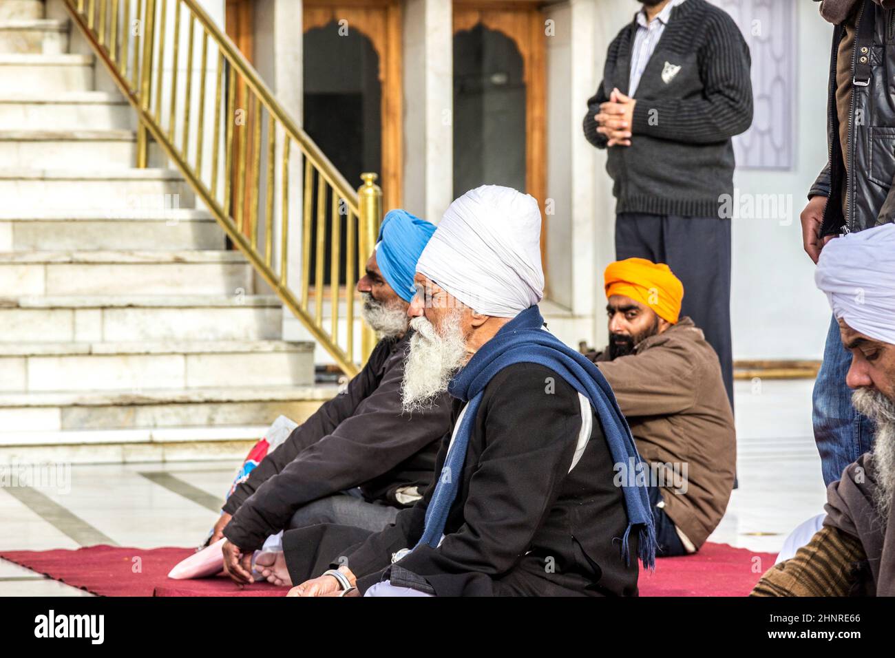people pray in the Harimandir Sahib at the Golden temple complex ...