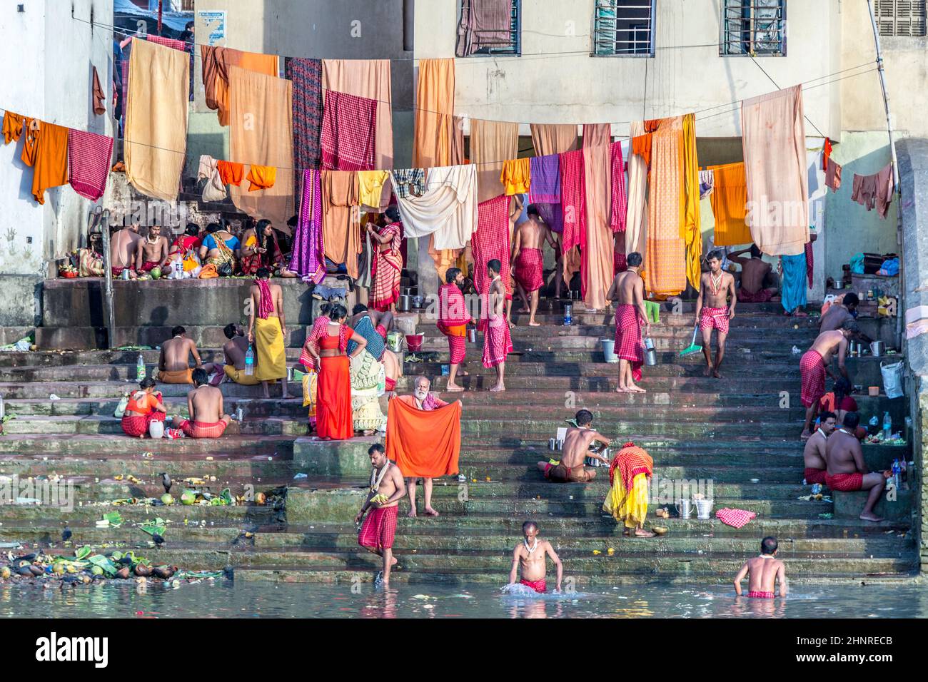 people cleaning clothes and washing in the river Ganges in Calcutta ...