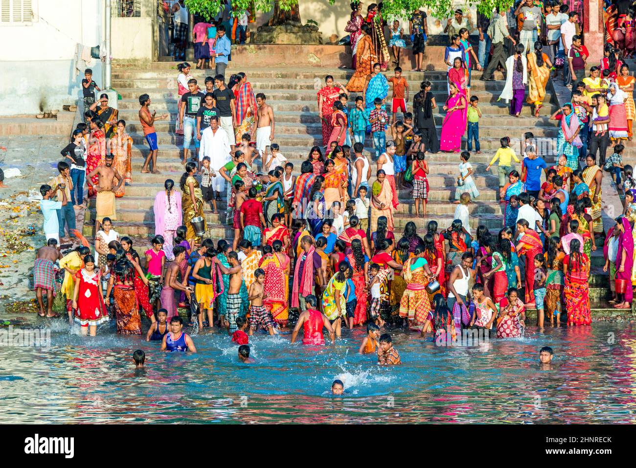 people cleaning clothes and washing in the river Ganges in Calcutta ...
