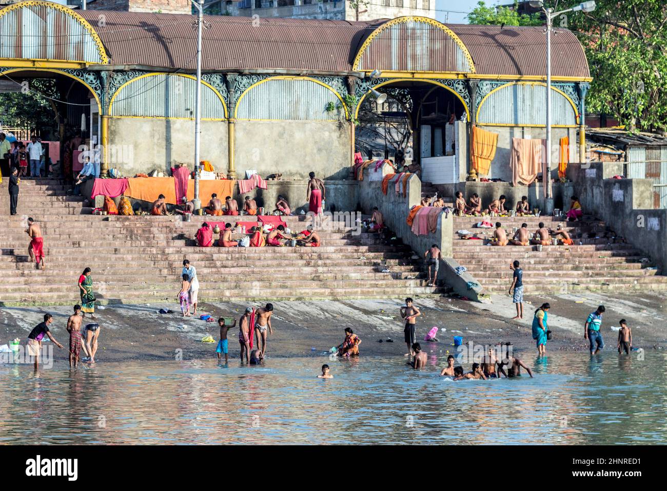 people cleaning clothes and washing in the river Ganges in Calcutta ...