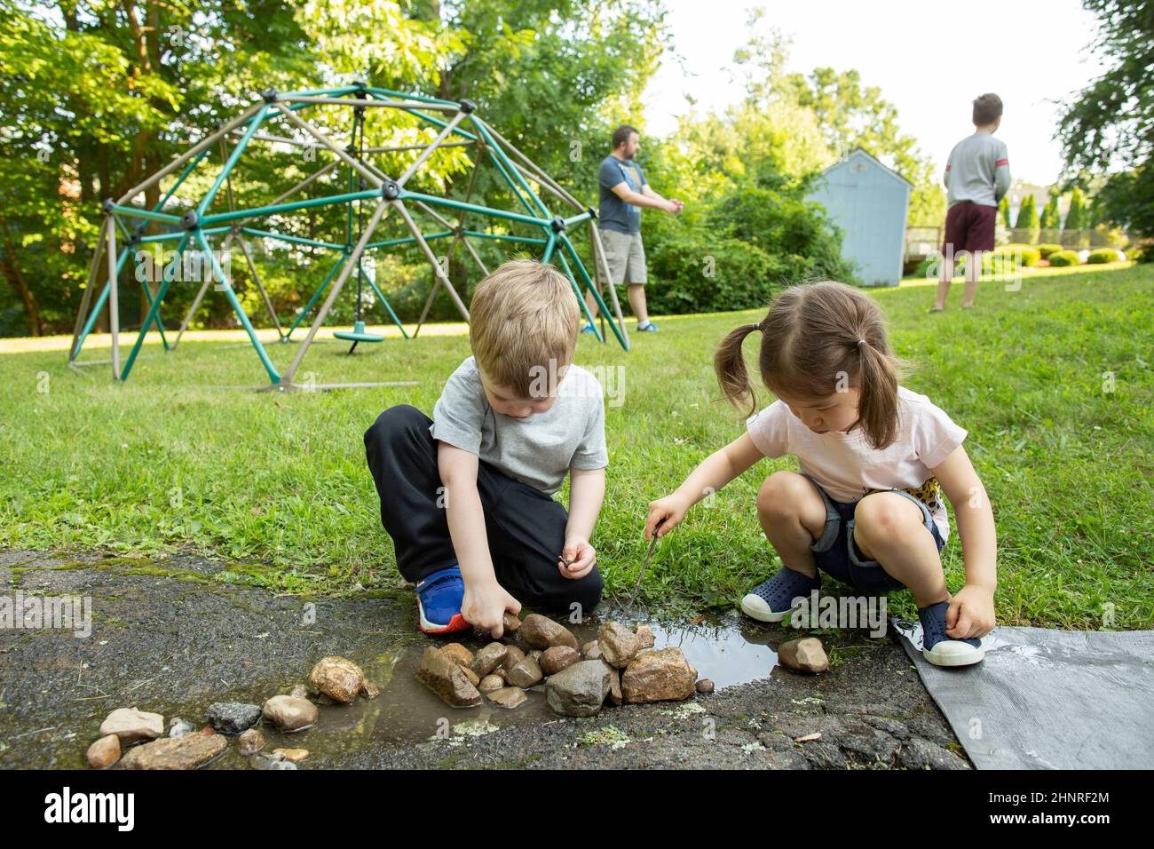 Family and Friends Playing outside Together in Backyard Stock Photo - Alamy