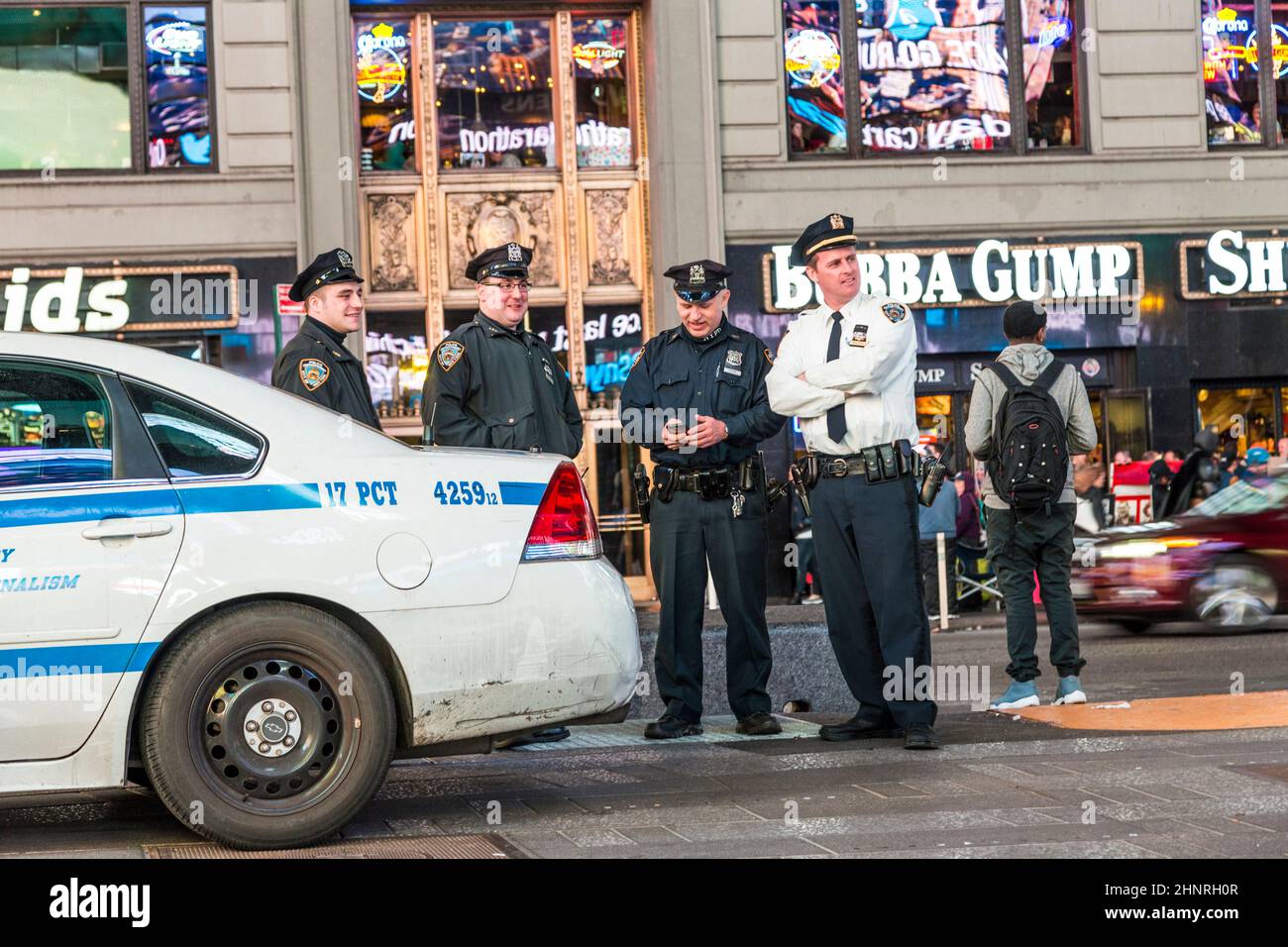 police pays attention at times square by night Stock Photo - Alamy