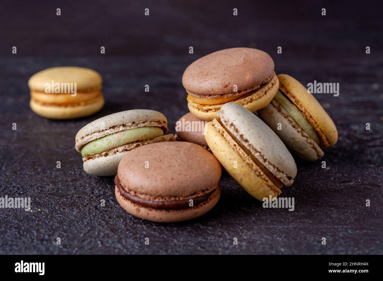 macaroons are scattered on a blue texture background, selective Stock ...