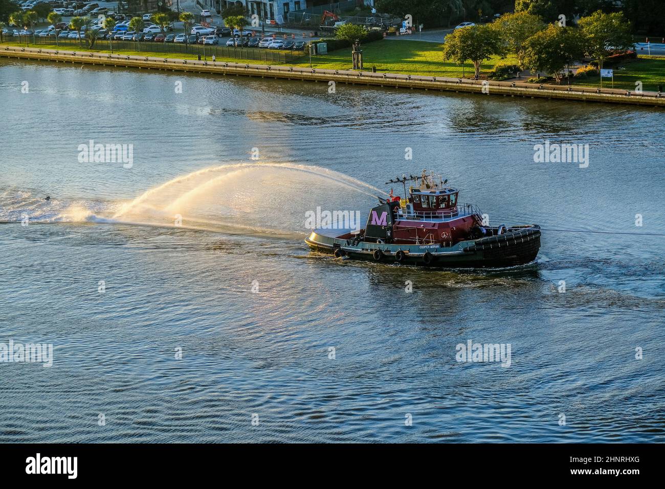 Tugboat Water Salute in Early Morning Stock Photo - Alamy
