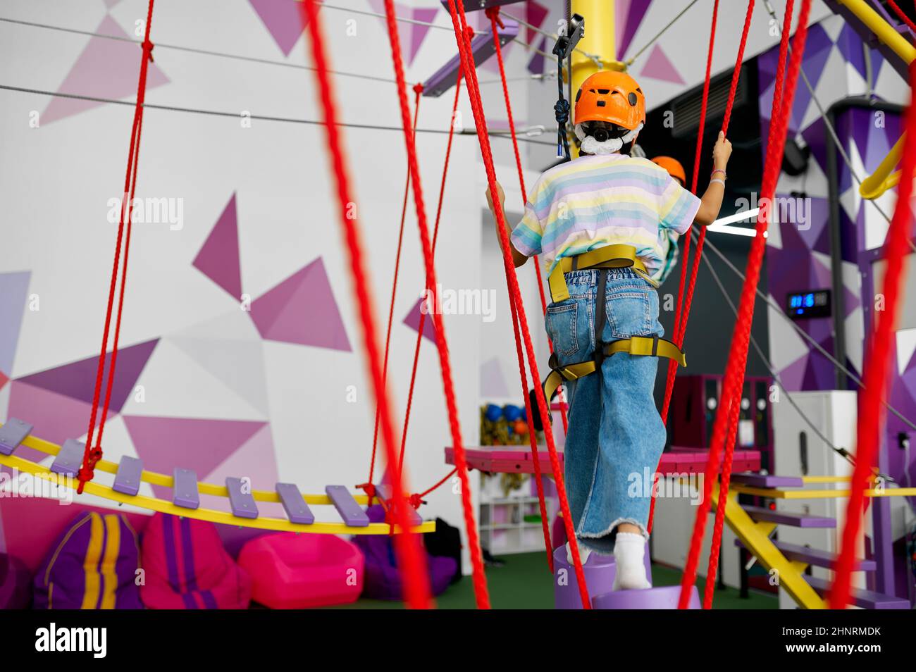 Children climb on zip line in entertainment center, little climbers ...