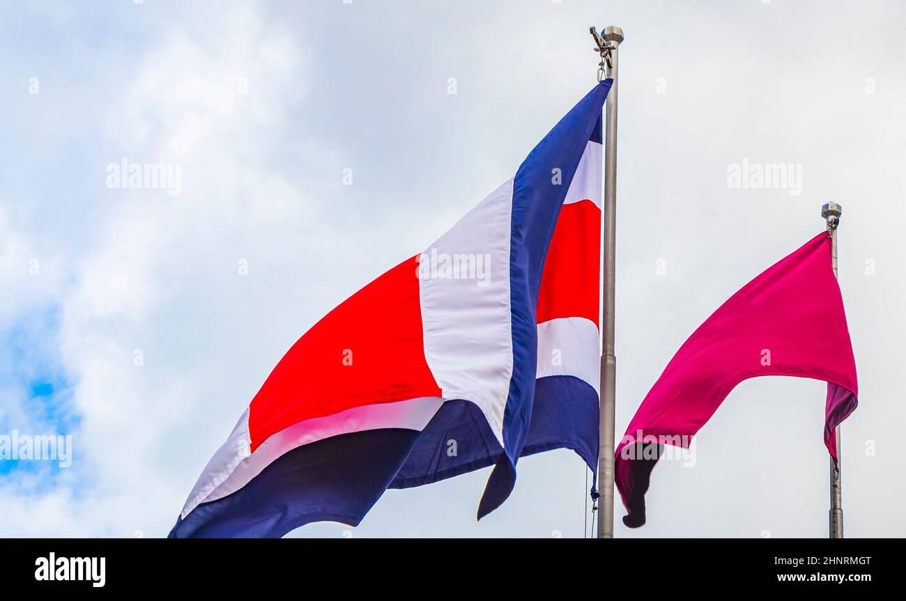 Flag of Costa Rica with cloudy blue sky and background Costa Rican flag ...