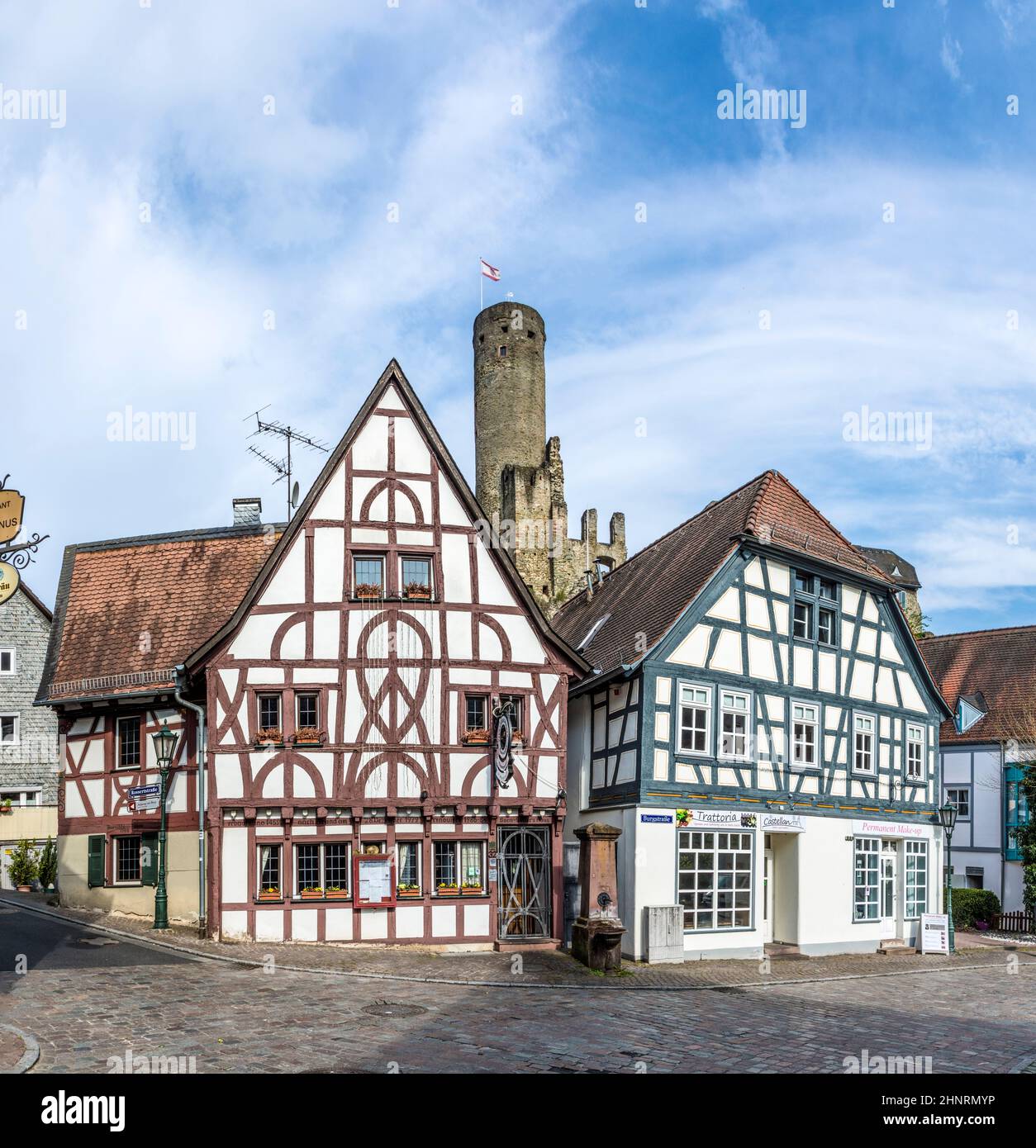 scenic view to old half timbered houses and the old castle of Eppstein ...