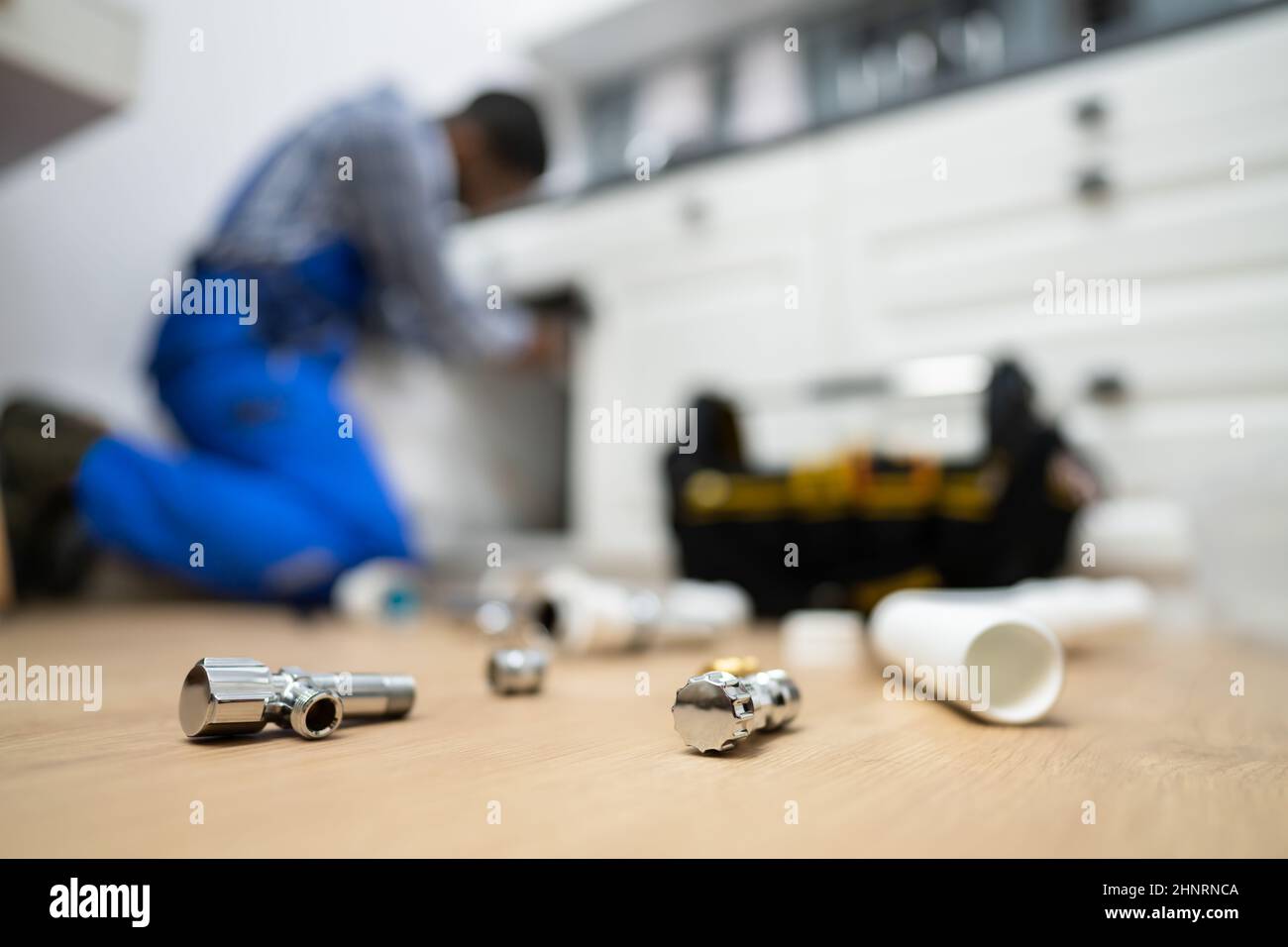 Plumber Fixing Kitchen Pipes. Water Sink Service Stock Photo - Alamy