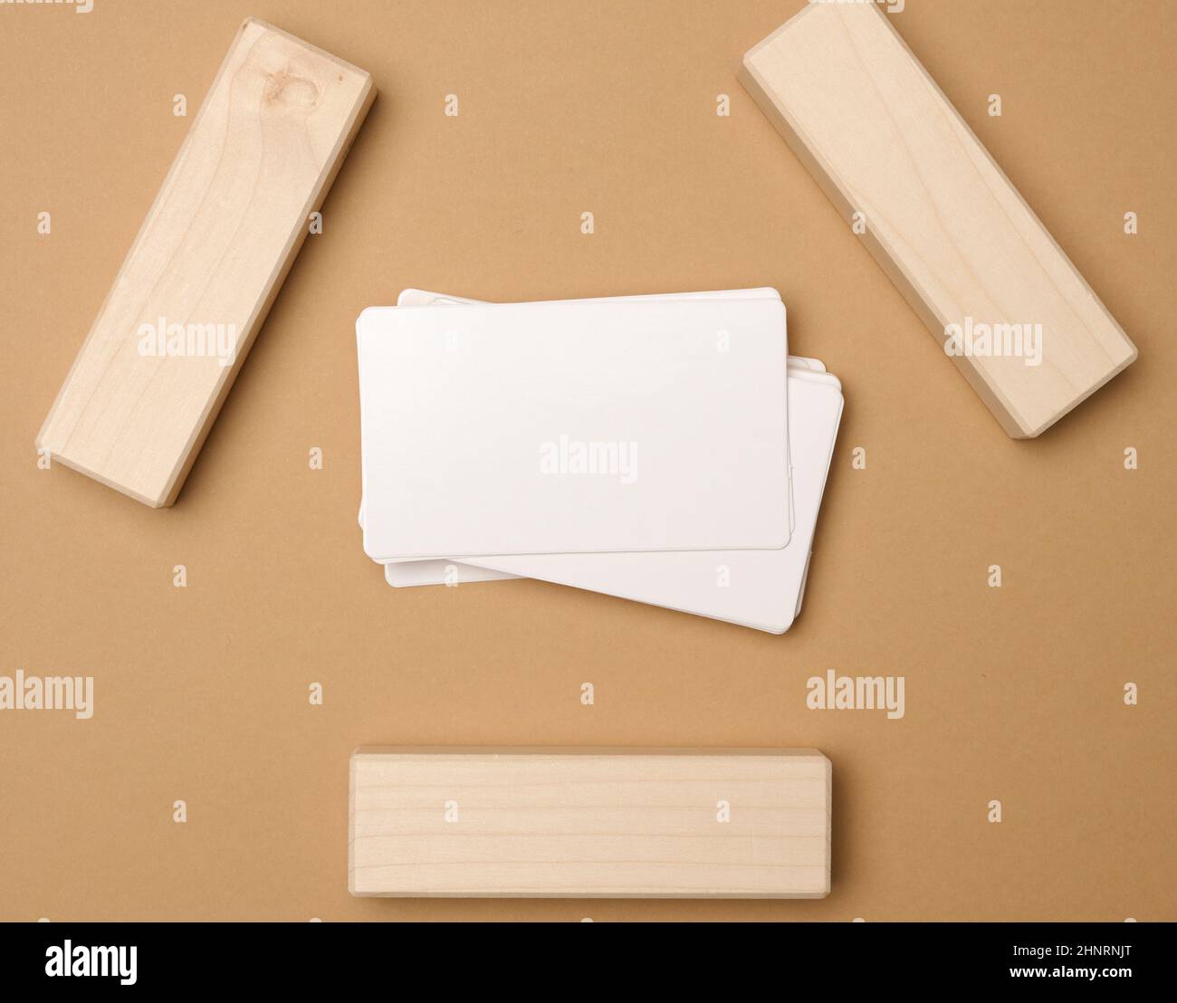stack of white rectangular business cards on a brown background ...