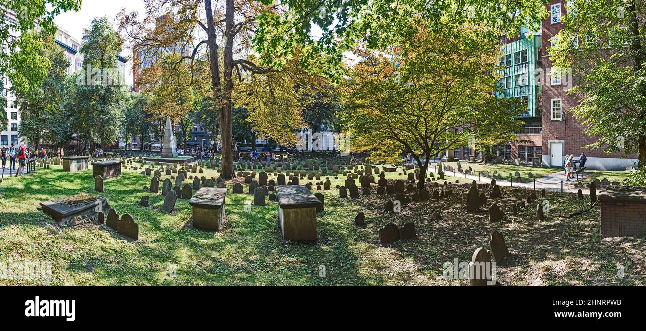 Rows of headstones under a tree at Granary Burial Ground. It became a ...