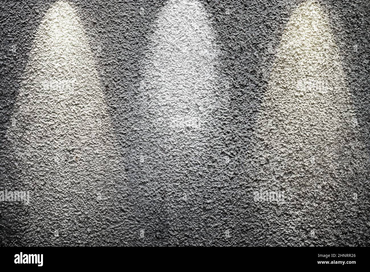 Close up view on concrete wall textures with three spotlights in high ...