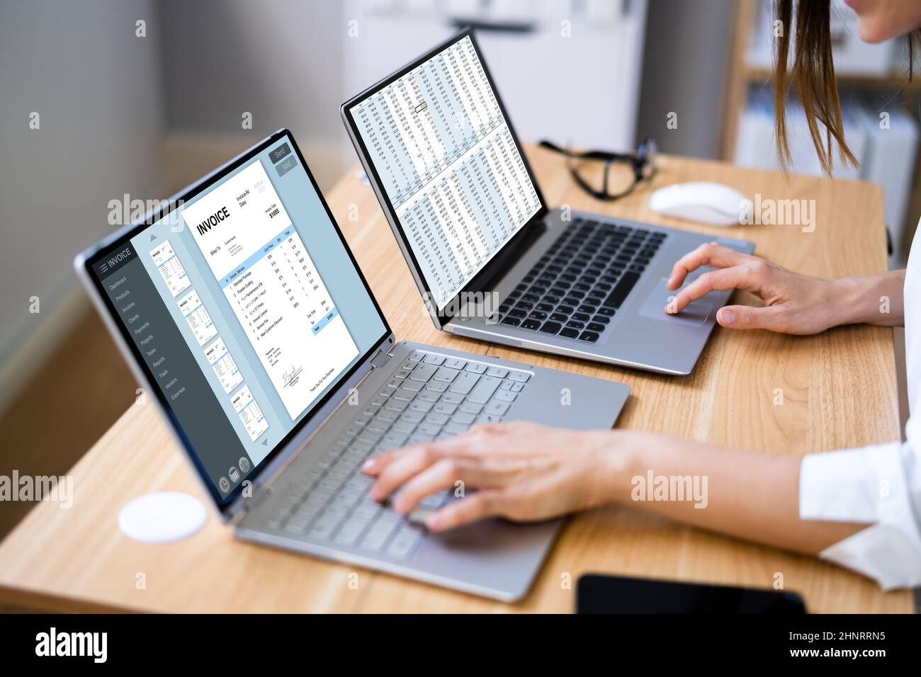 Businesswoman Looking At Invoice On Computer Screen In The Office Stock ...