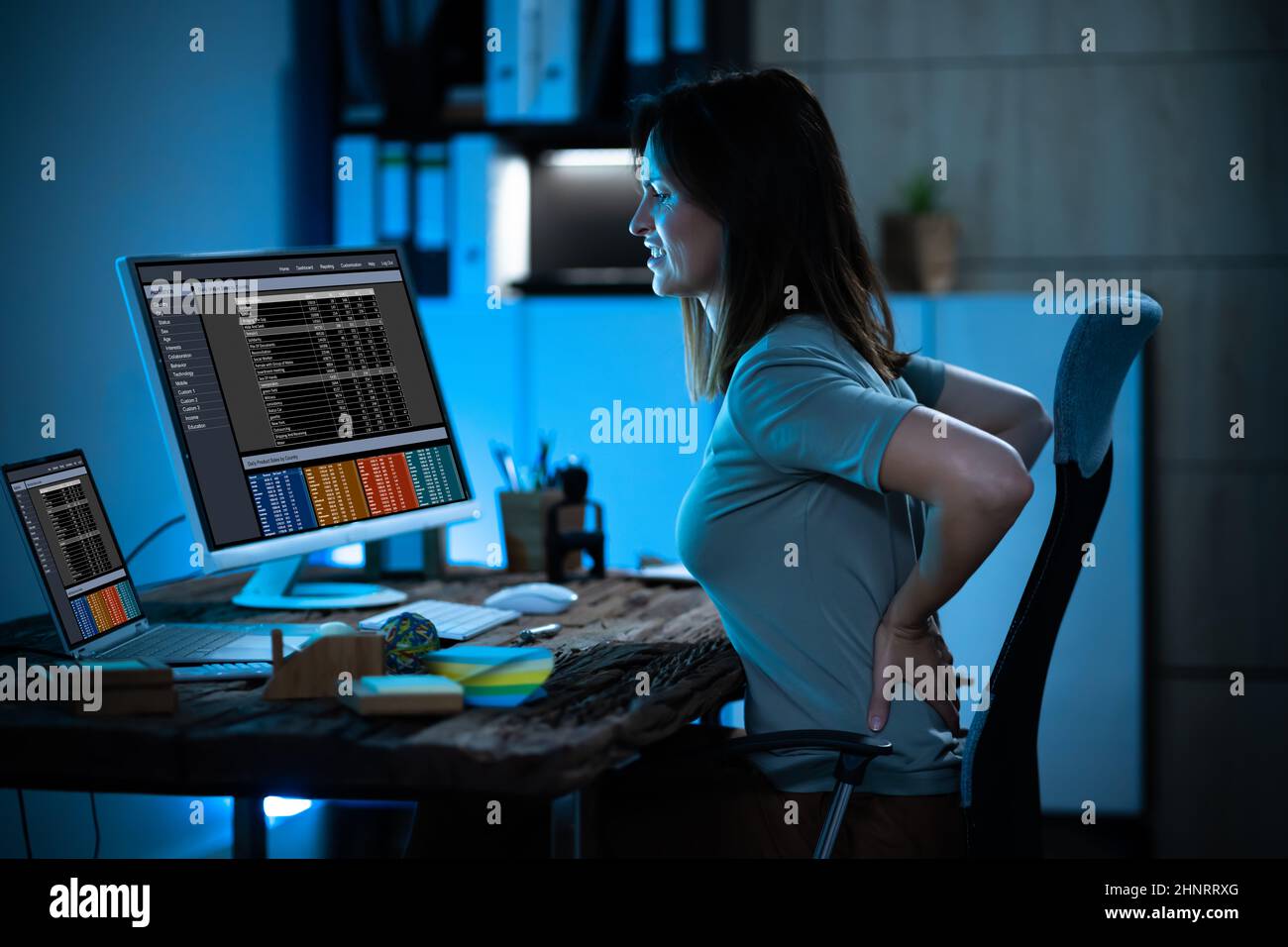 Back Pain At Work Chair In Office Stock Photo - Alamy