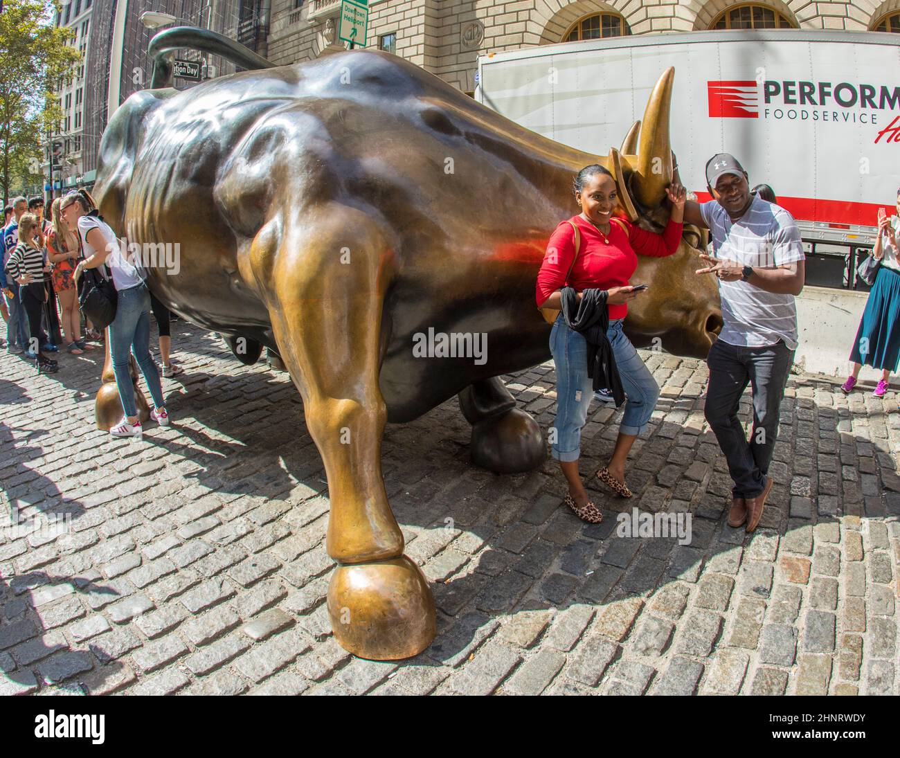 people visit charging Bull in Lower Manhattan in New York City Stock Photo - Alamy