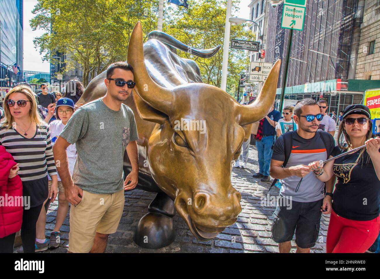 people visit charging Bull in Lower Manhattan in New York City Stock Photo - Alamy