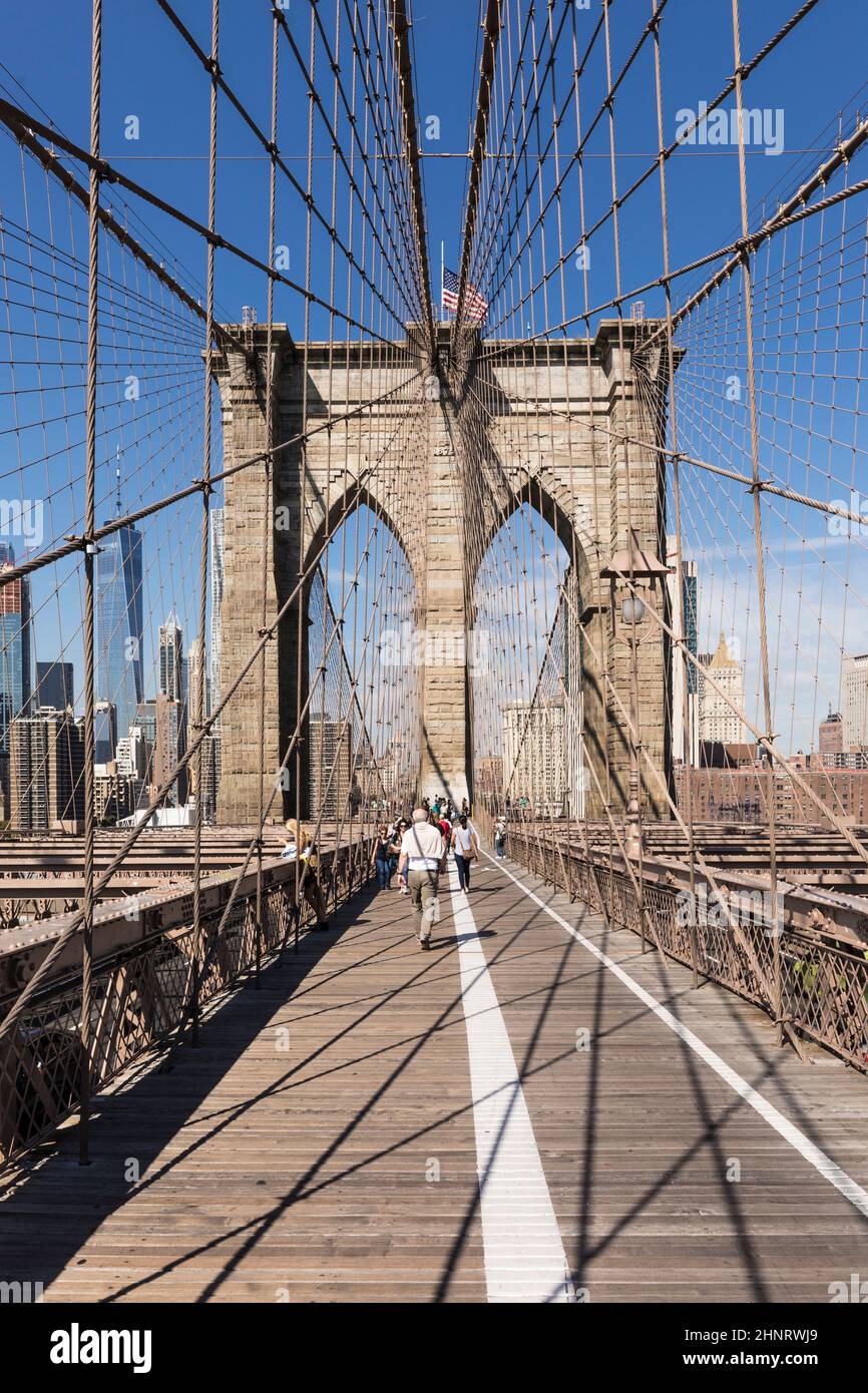 people cross famous Brooklyn Bridge in New York Stock Photo - Alamy