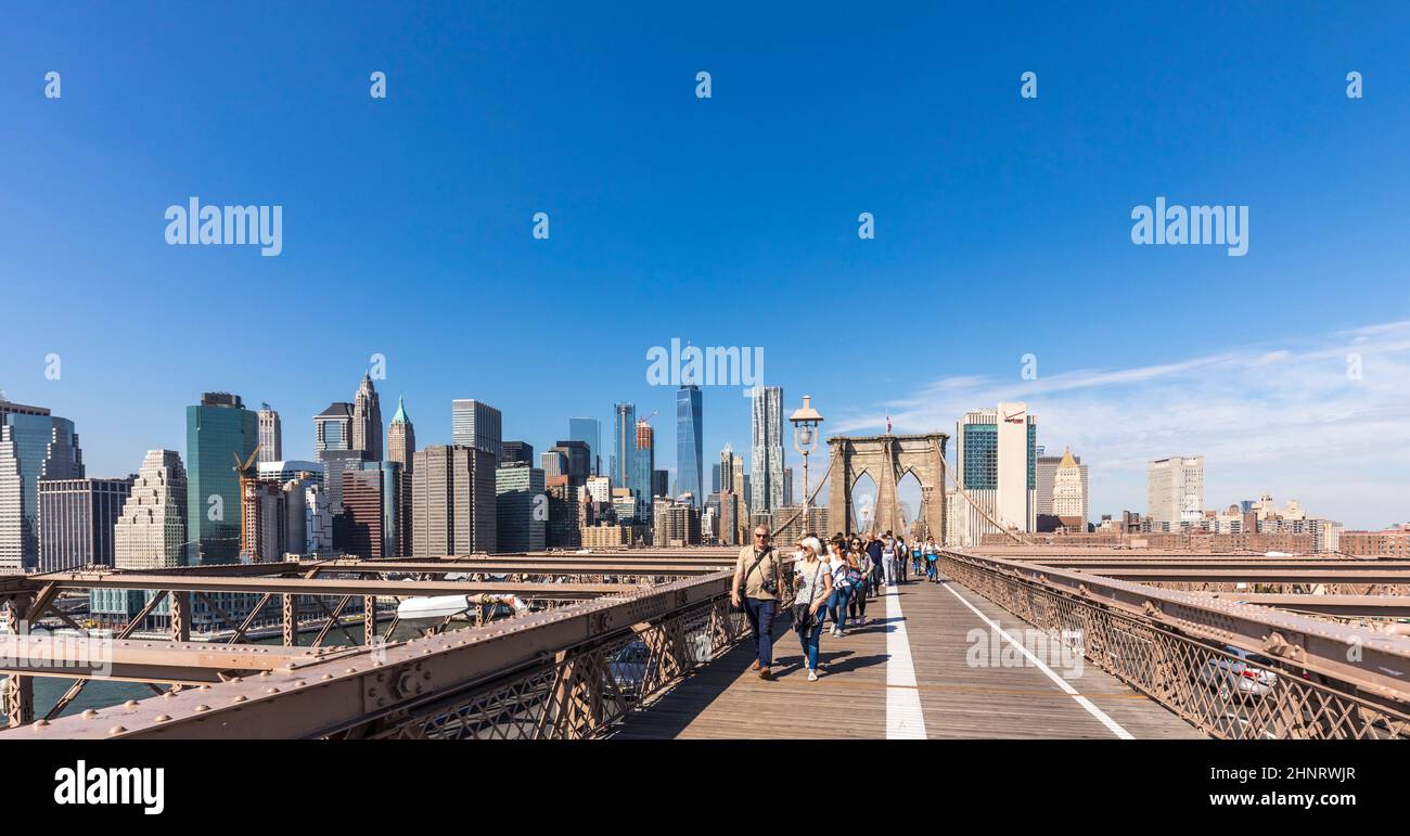 people cross famous Brooklyn Bridge in New York Stock Photo - Alamy