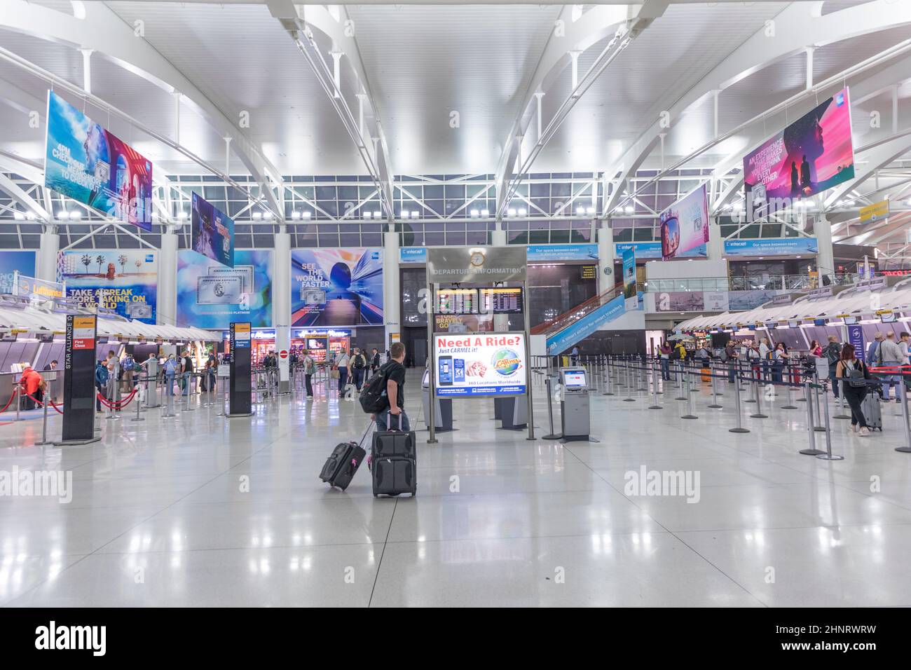 people ready for check in at Terminal 4 in JFK airport Stock Photo - Alamy