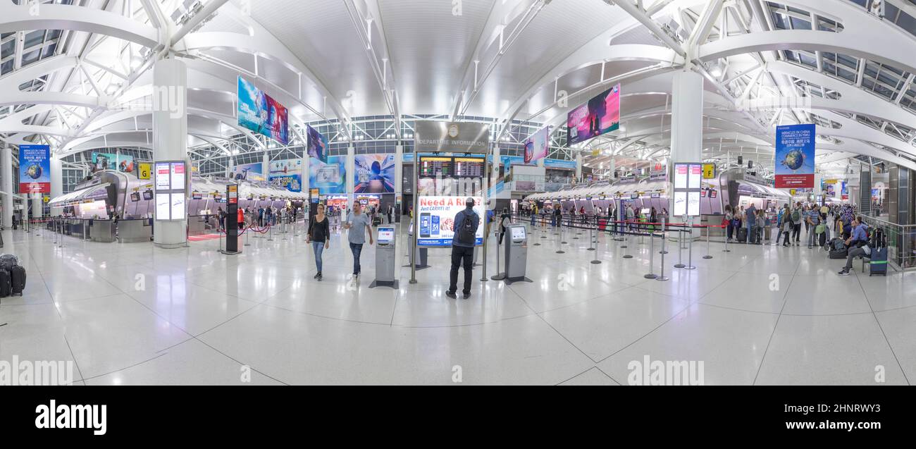 people ready for check in at Terminal 4 in JFK airport Stock Photo - Alamy