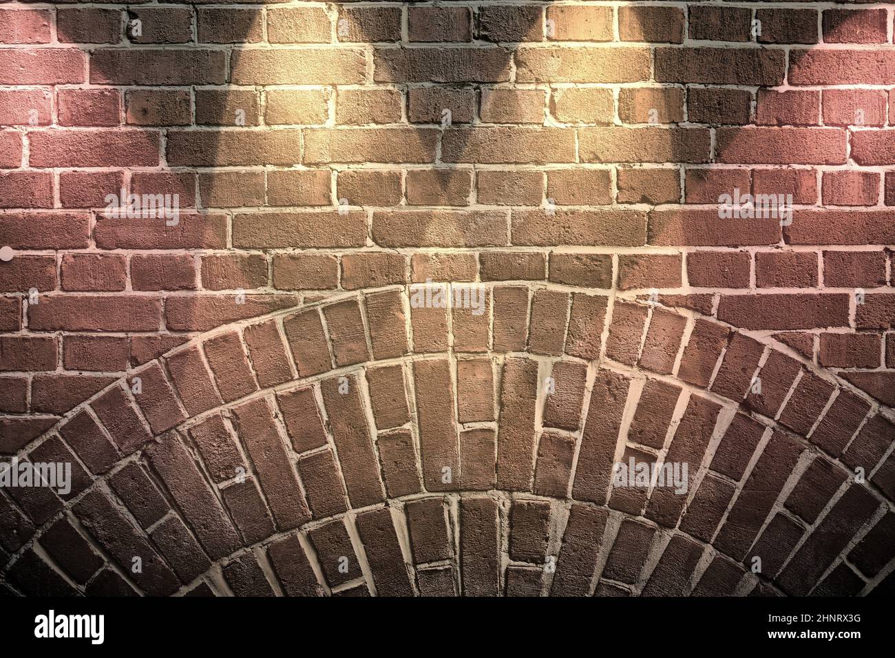 Aged and weathered brick wall textures with bright spotlight ...