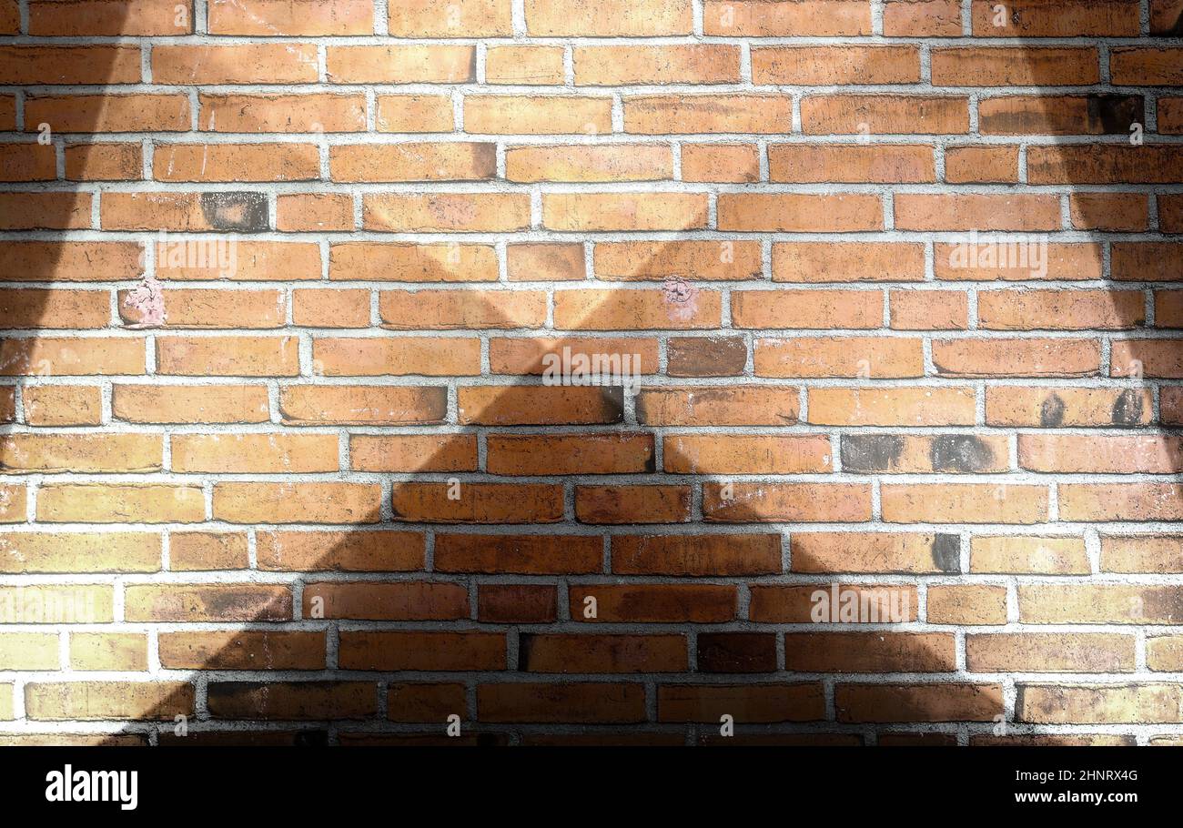 Aged and weathered brick wall textures with bright spotlight ...