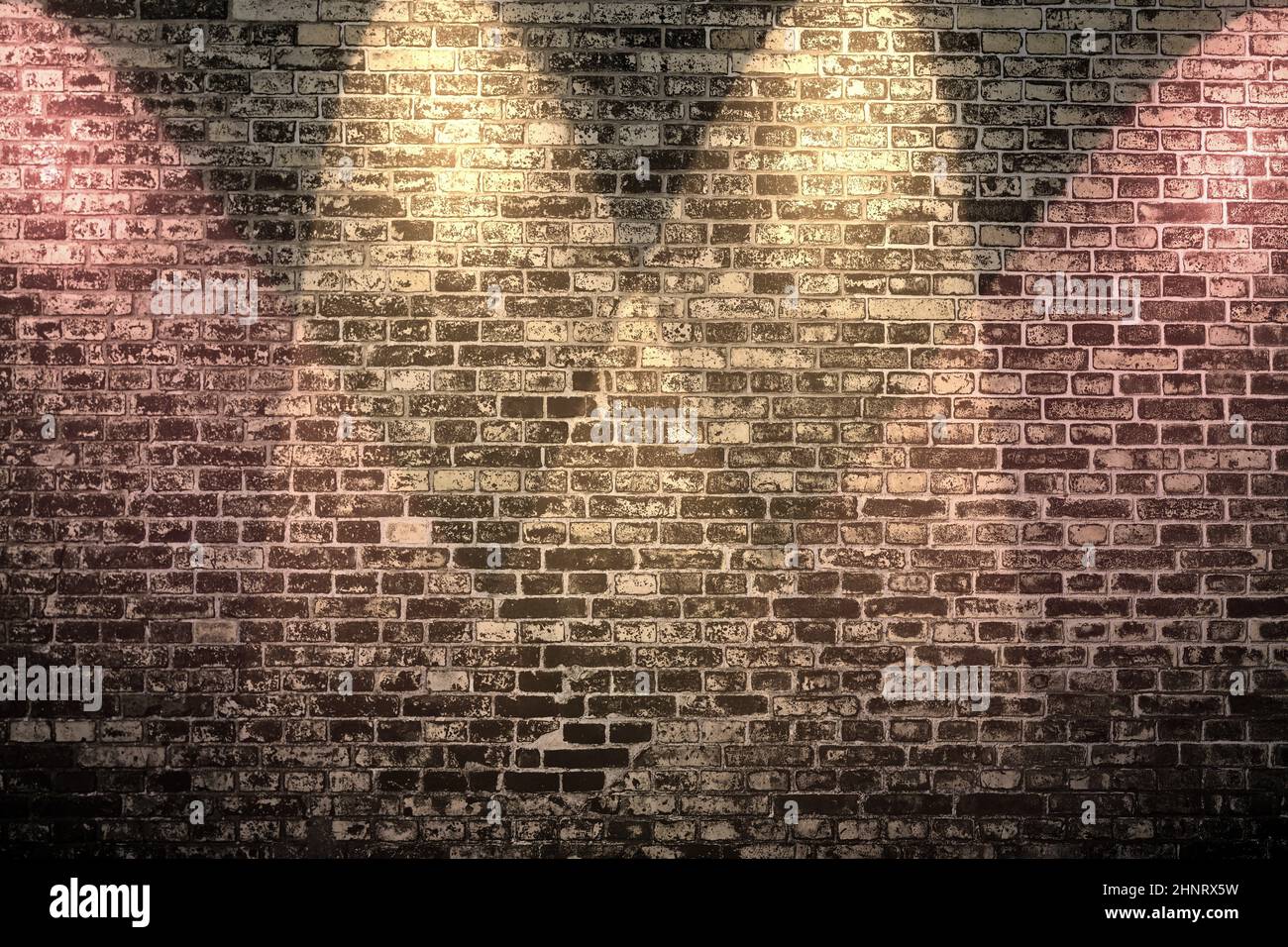 Aged and weathered brick wall textures with bright spotlight ...