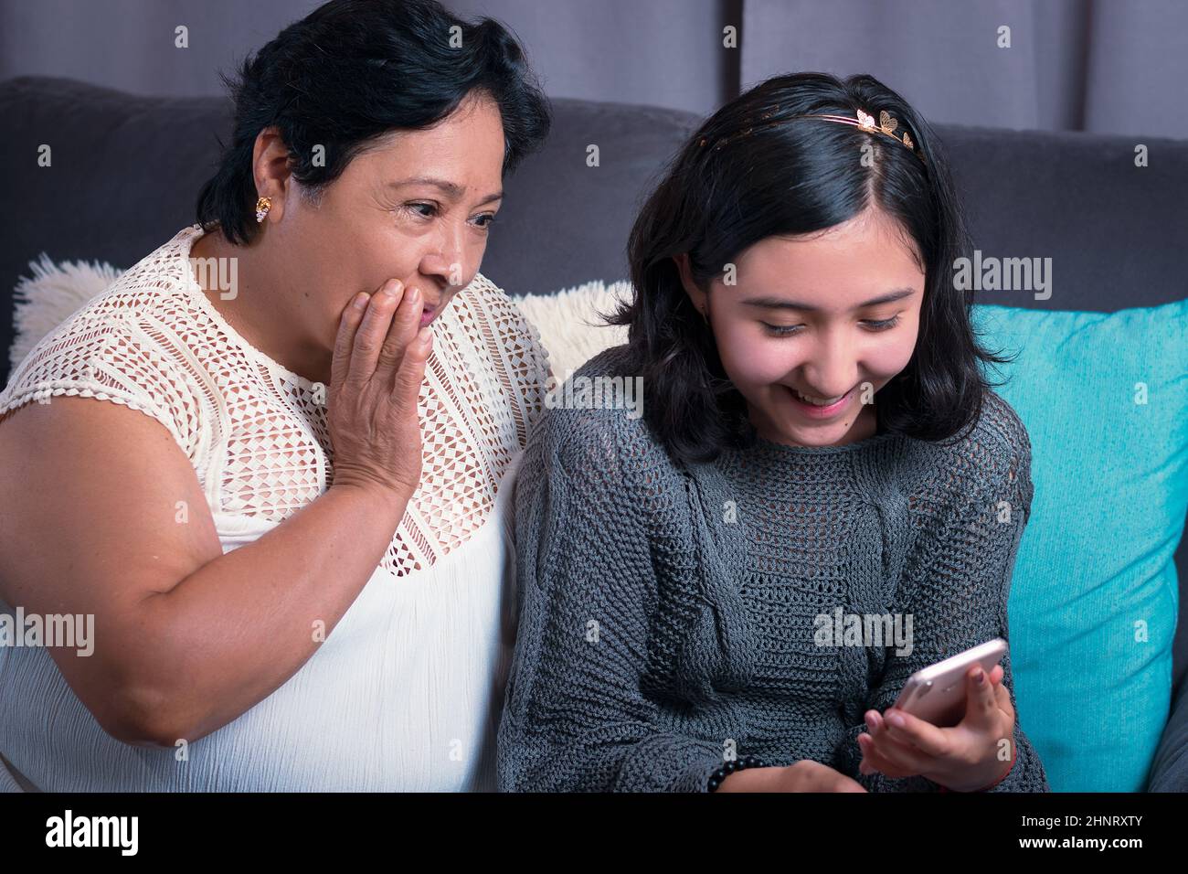 Older Woman 60 Year Old Latin Grandmother Using Cell Phone And Having
