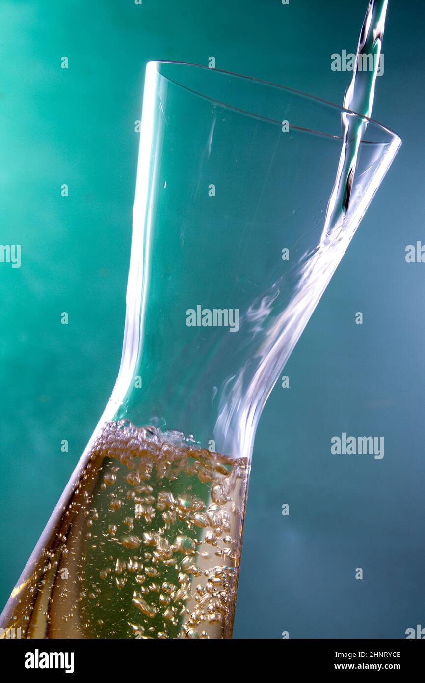 Pour white wine into a carafe Stock Photo - Alamy