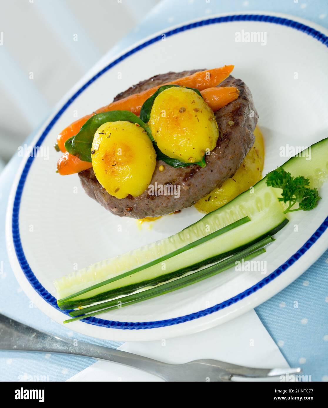 Beef patty with baked vegetables Stock Photo - Alamy