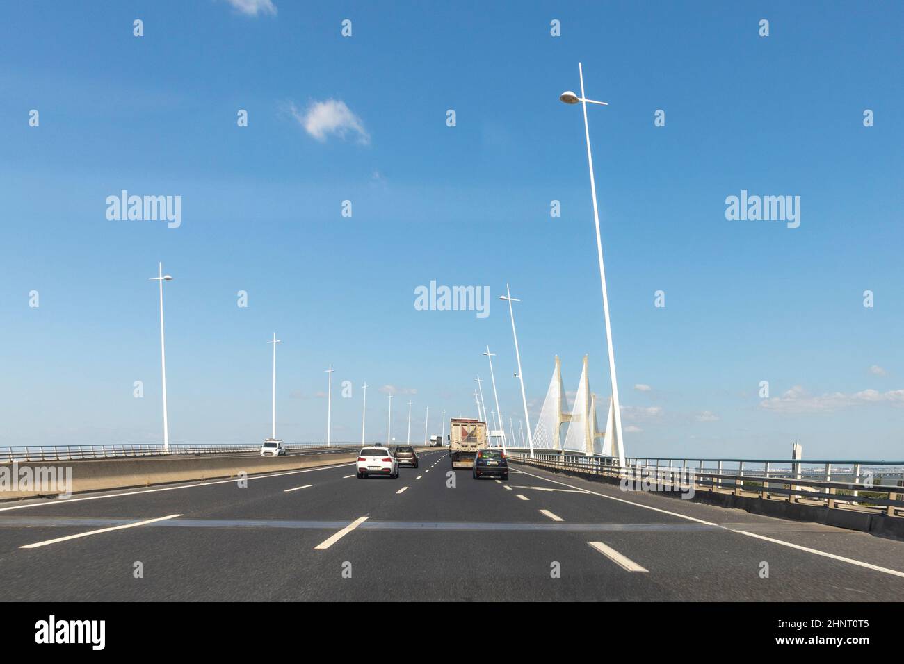 crossing the Vasco da Gama bridge spanning river Tejo in Lisbon ...