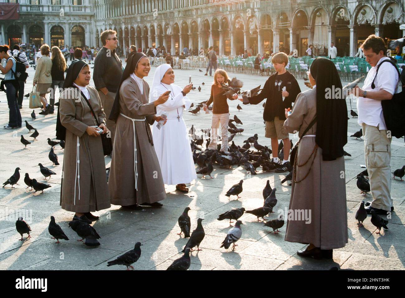 Nun feeding pigeons hi-res stock photography and images - Alamy