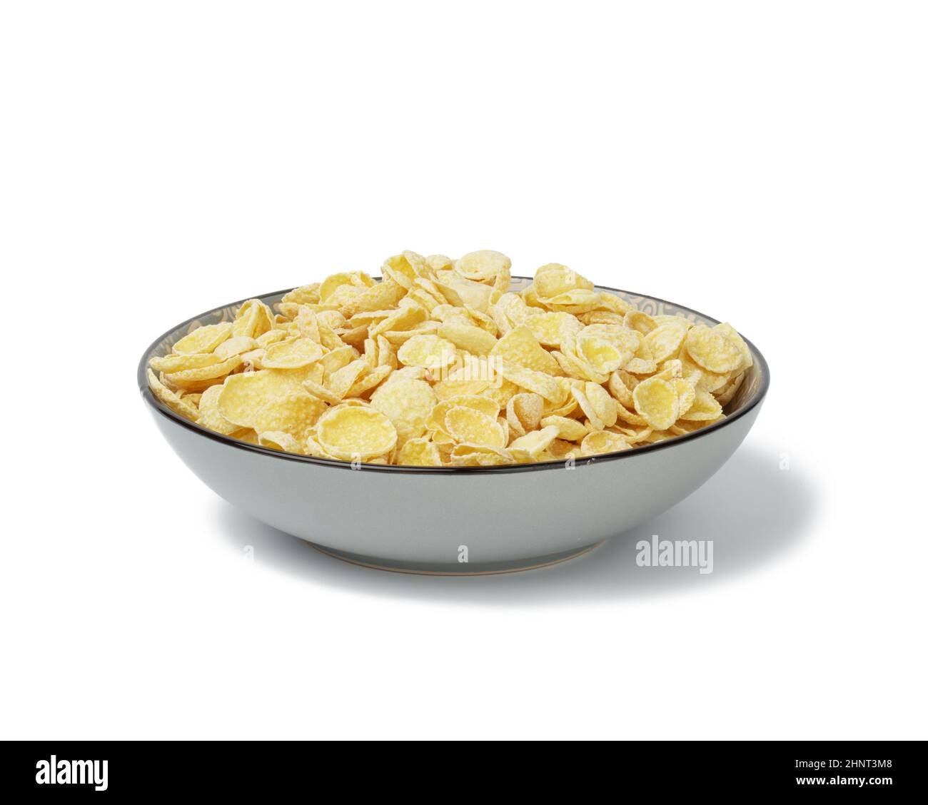 honey cornflakes on a white background. Morning breakfast with milk ...