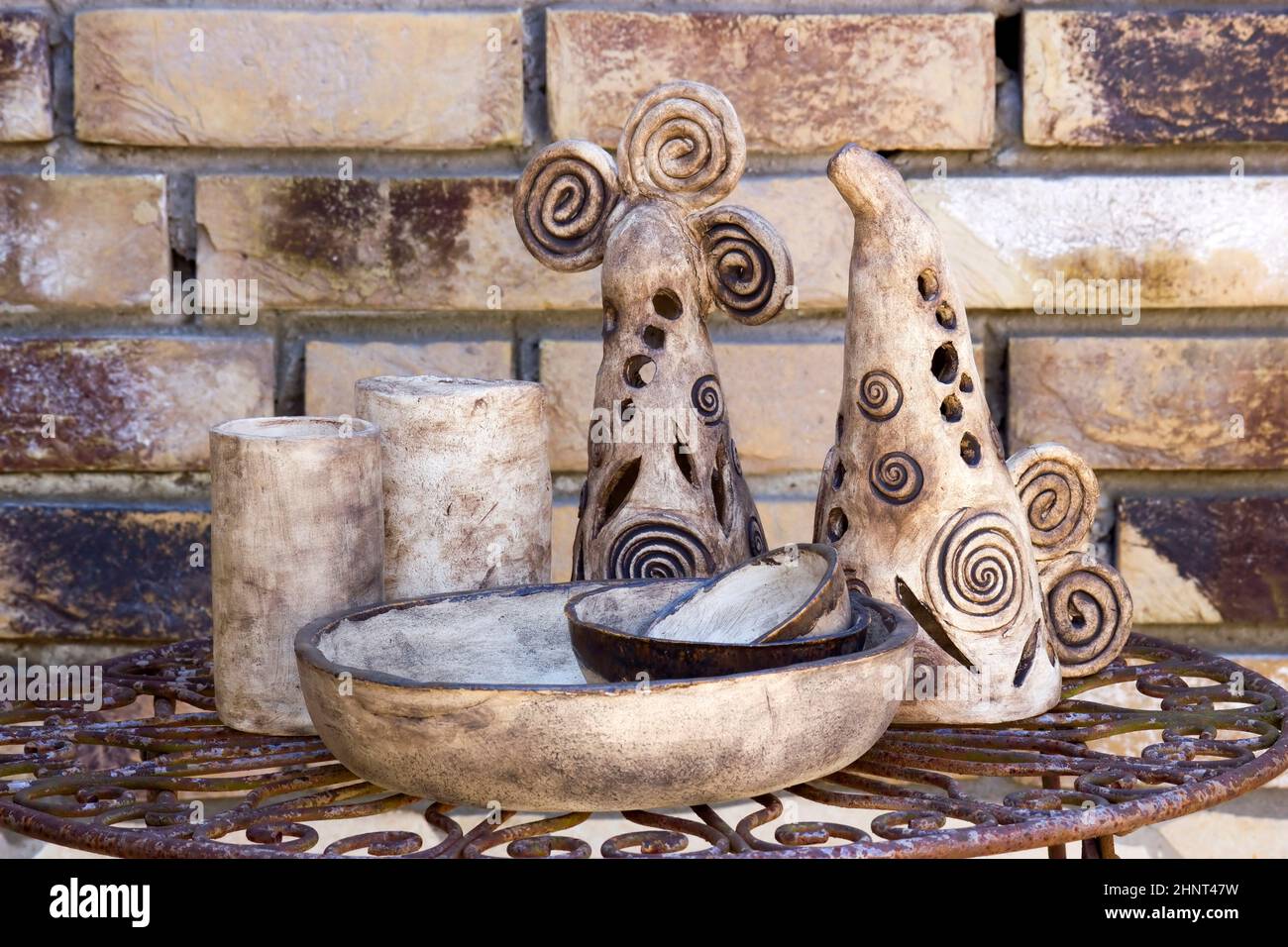 clay pots on a metal table - handmade pottery Stock Photo - Alamy